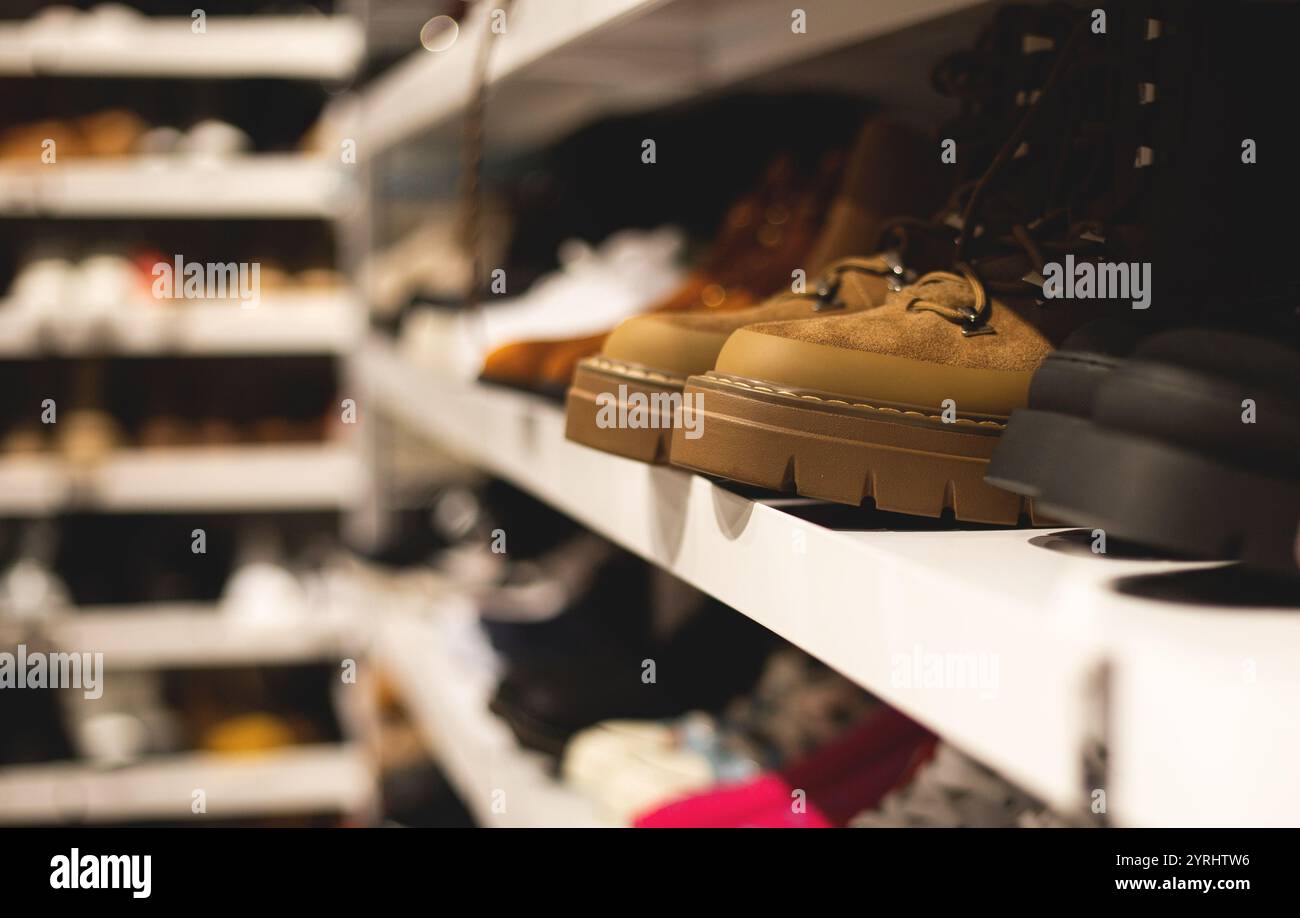 Lots of clothes and shoes in a clothing store Stock Photo - Alamy