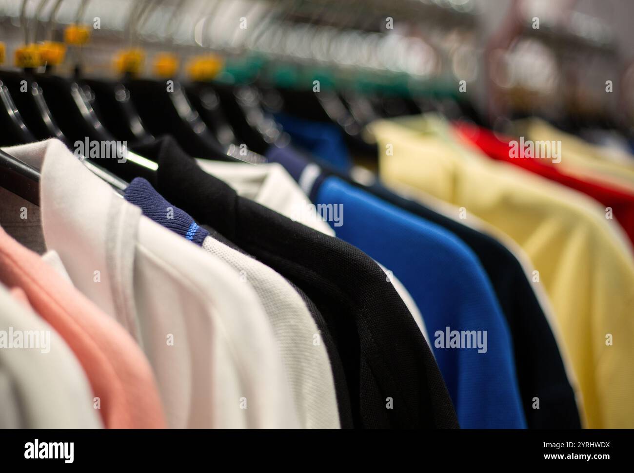 Lots of clothes and shoes in a clothing store Stock Photo - Alamy