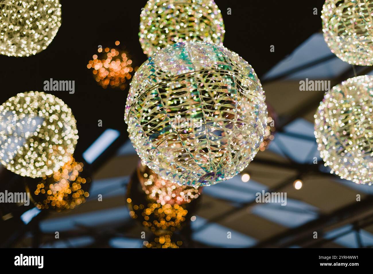 A cluster of lights in the shape of balls. The balls are lit up and are ...