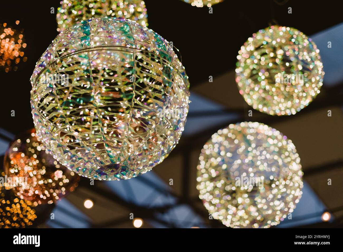 A cluster of lights in the shape of balls. The balls are lit up and are ...