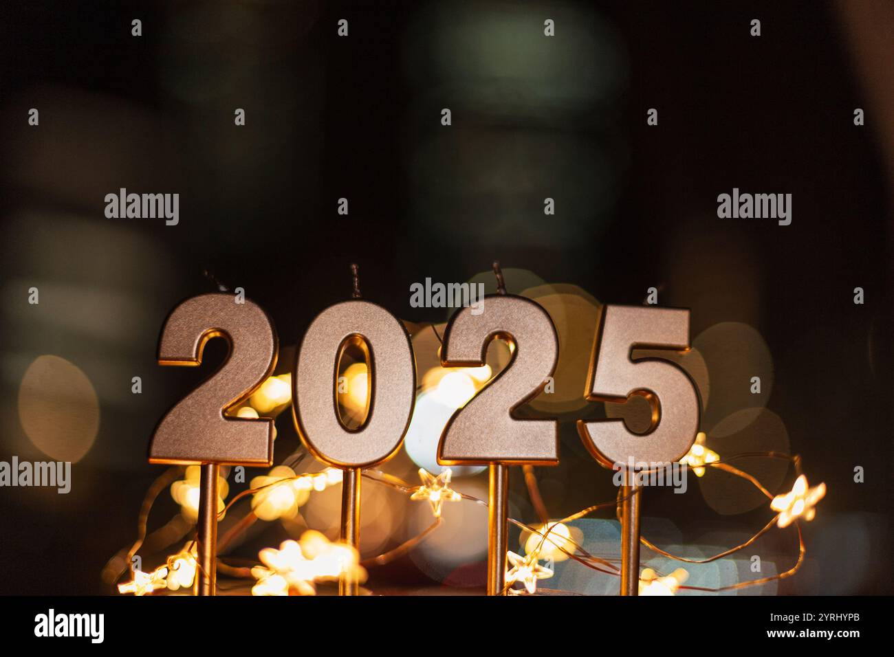 Beautiful festive gold 2025 candles at night with bokeh lights stars. Happy new year 2025 Stock ...