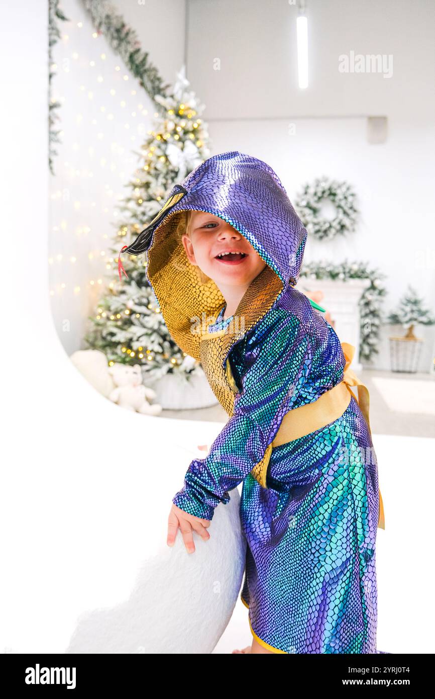 Child in a snake costume in an egg Stock Photo - Alamy