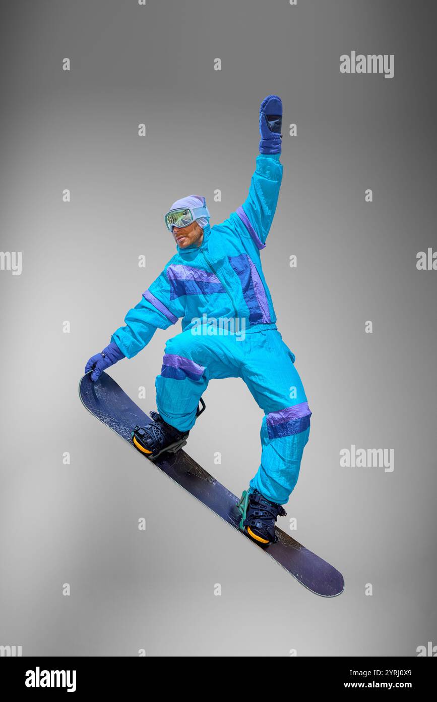 Dynamic photo of young athletic man in retro blue jumping suit ...