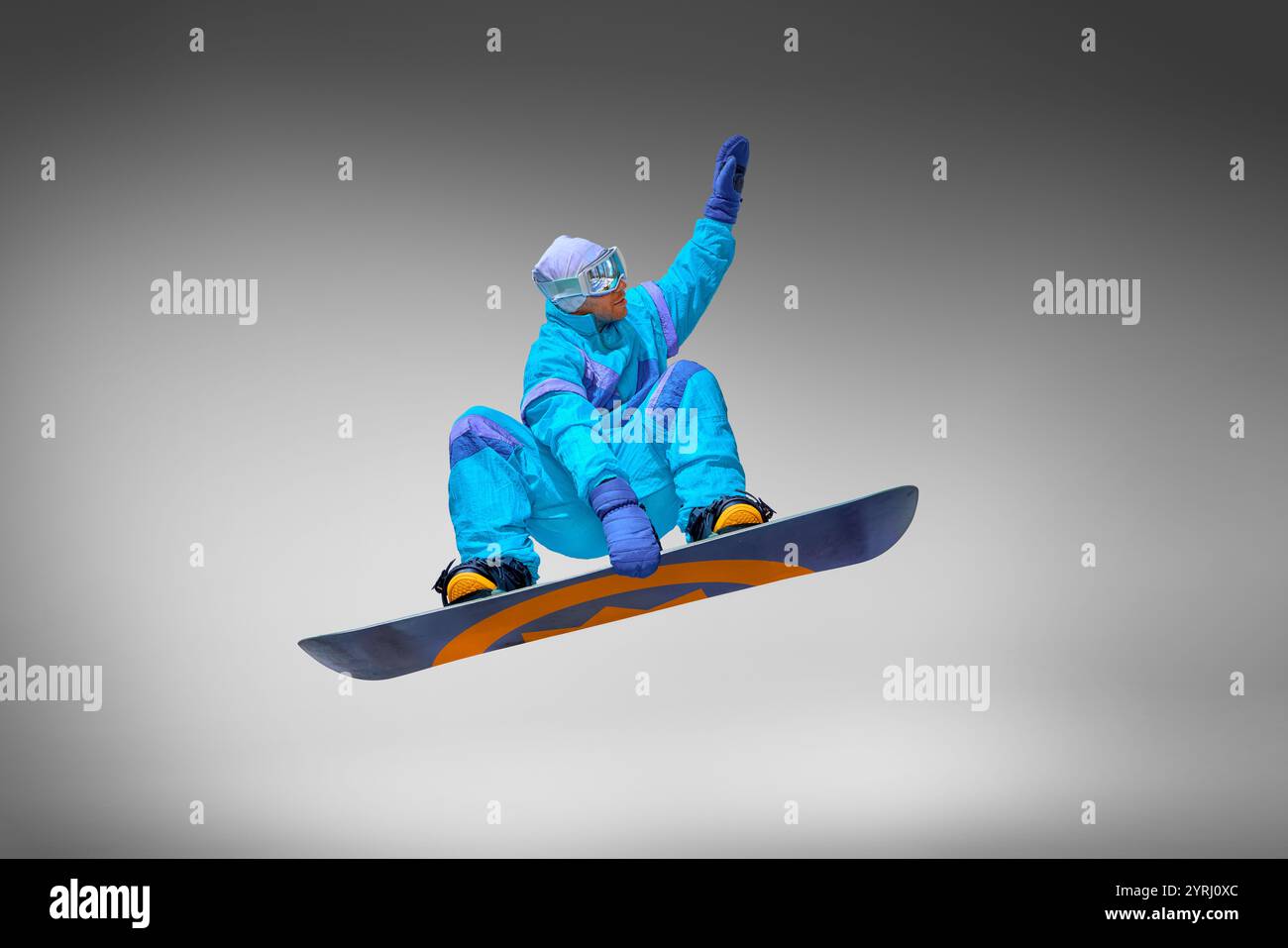 Dynamic photo of young athletic man in retro blue jumping suit ...