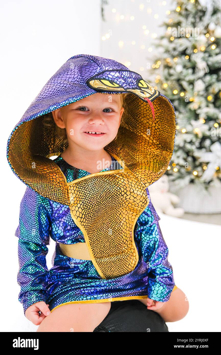 Child in a snake costume in an egg Stock Photo - Alamy