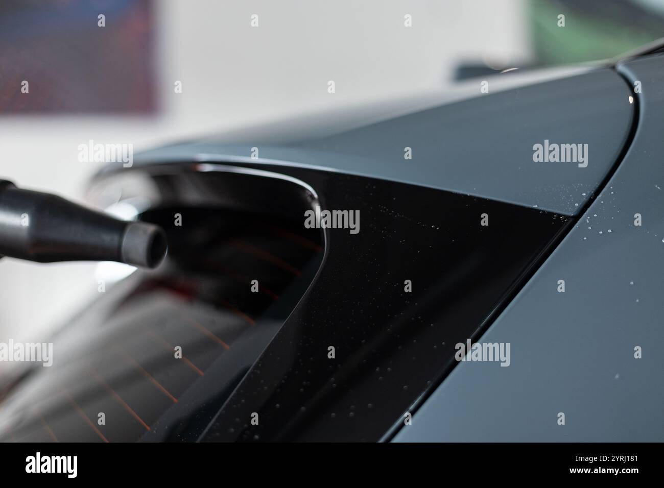 Men dry their cars with a professional dryer tools in the garage. Car ...