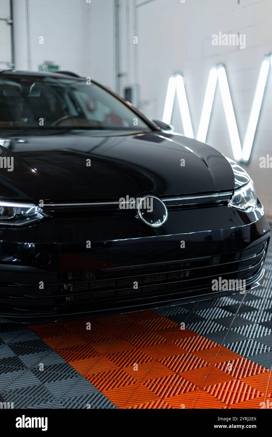 Modern black car in garage. Car care. Car detailing and washing Stock ...
