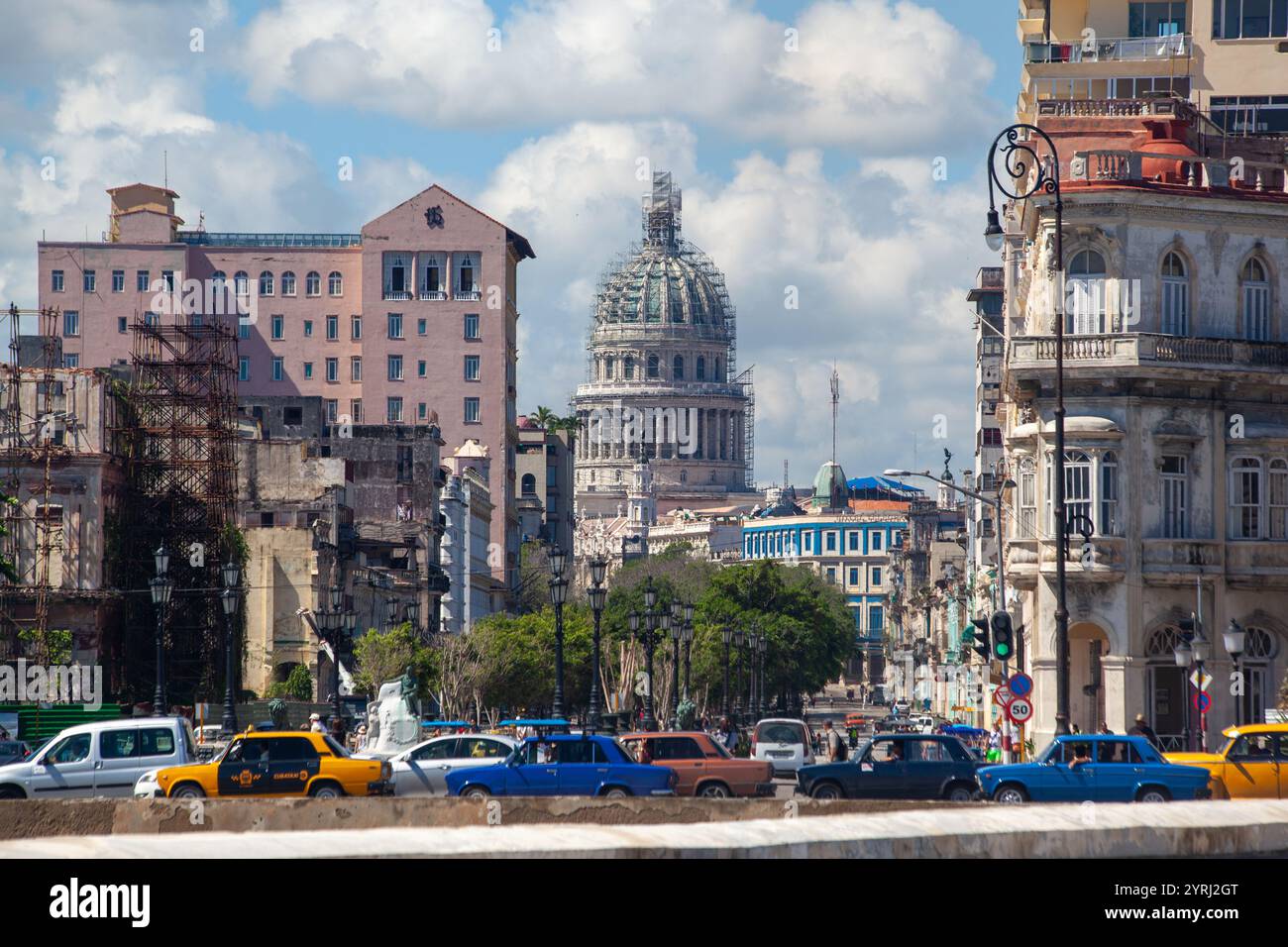 The National Capitol of Cuba dome and the traffic of vintage old ...