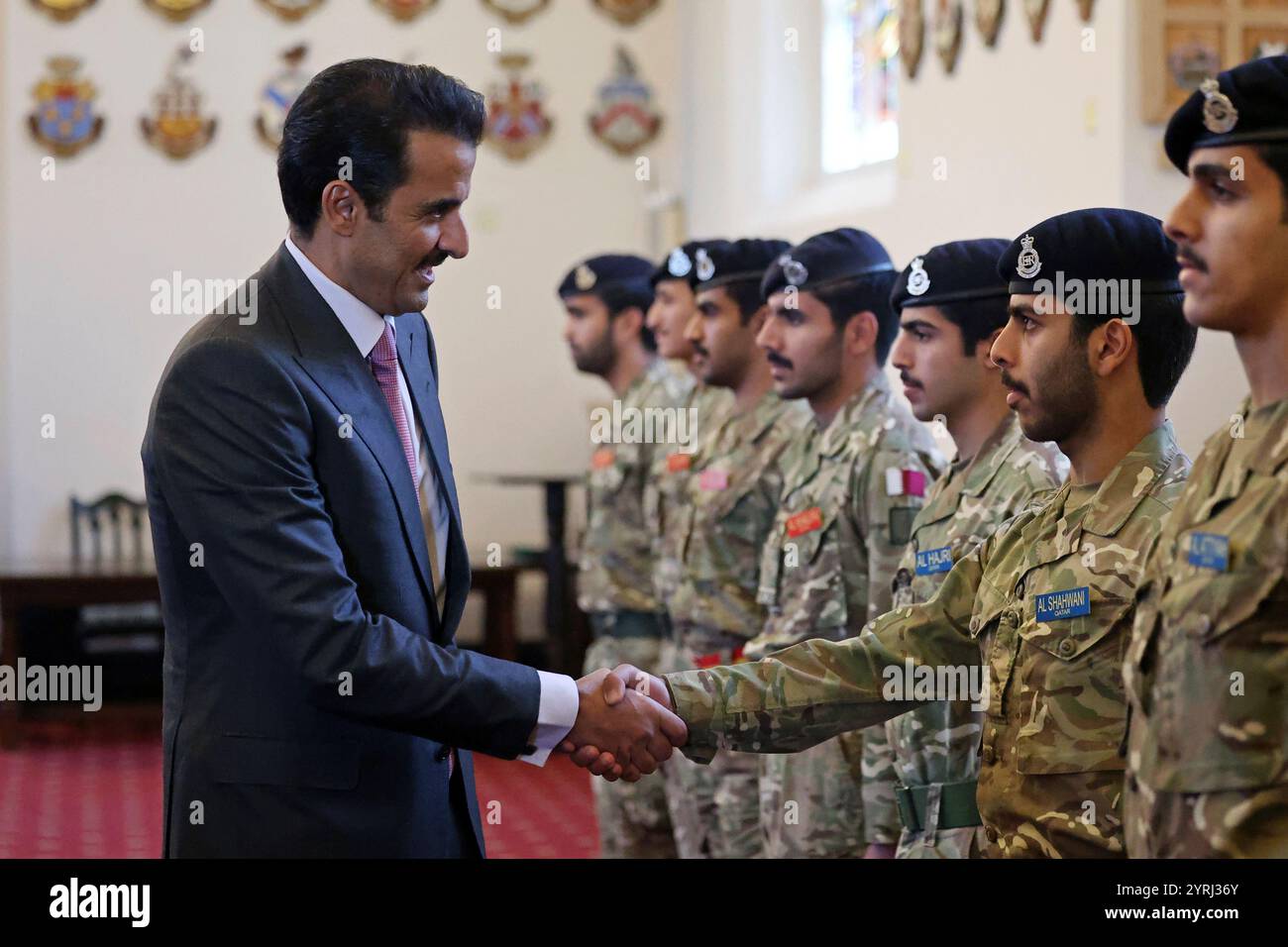 The Emir of Qatar, Sheikh Tamim bin Hamad Al Thani, left, speaks to ...