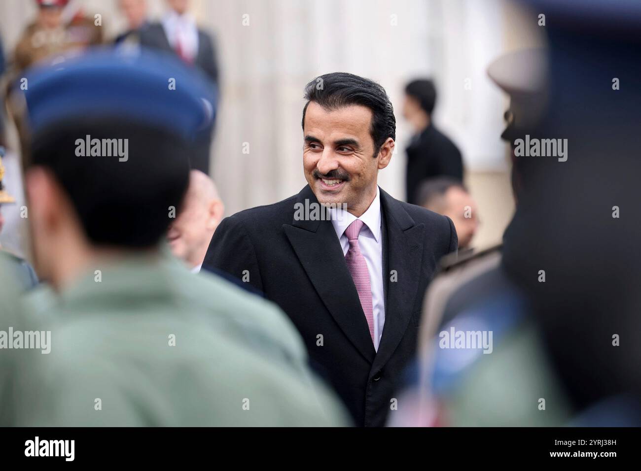 The Emir of Qatar, Sheikh Tamim bin Hamad Al Thani, lcenter, smiles ...
