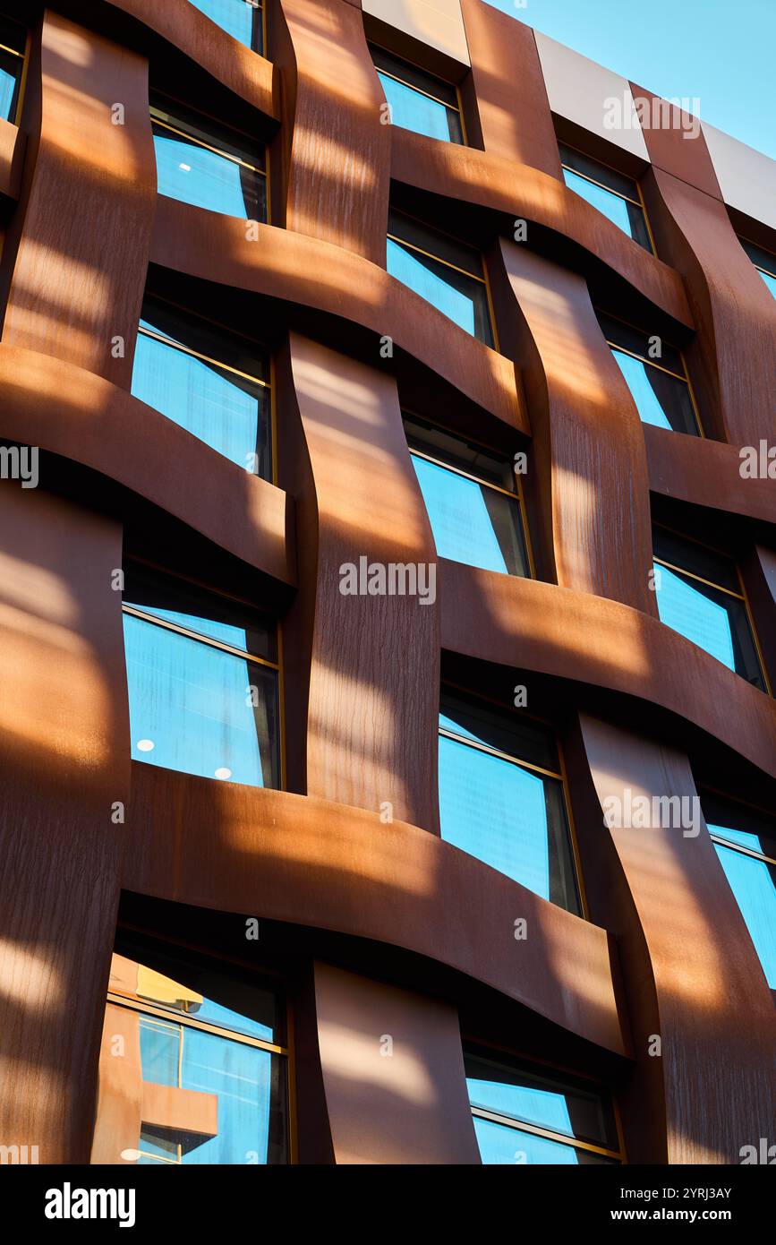 Architectural facade with dynamic curves and stunning reflections that ...
