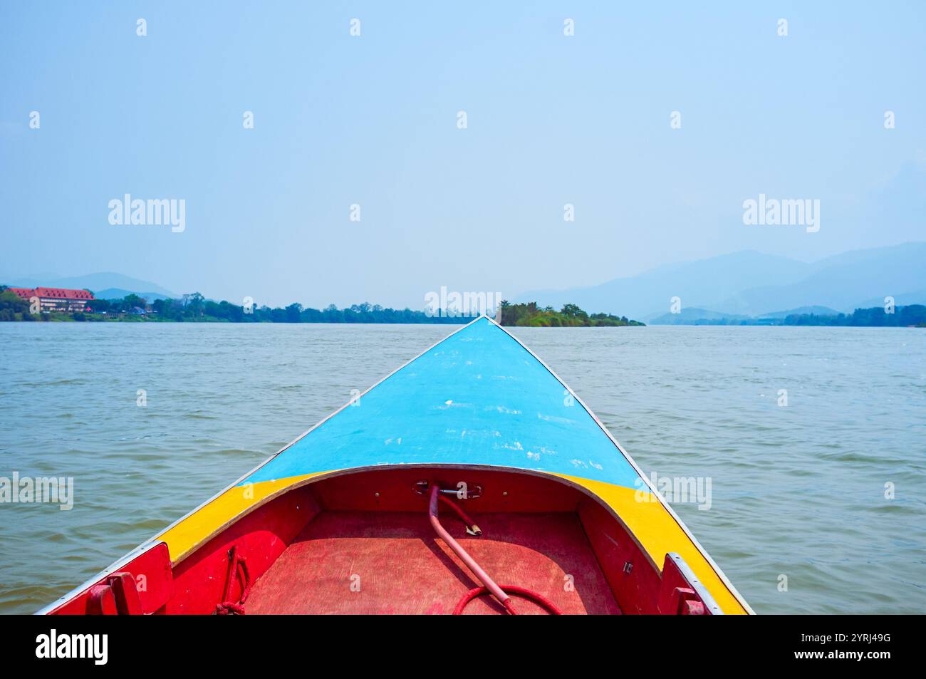 Boat trip along Mekong river in Golden Triangle area between Thailand ...