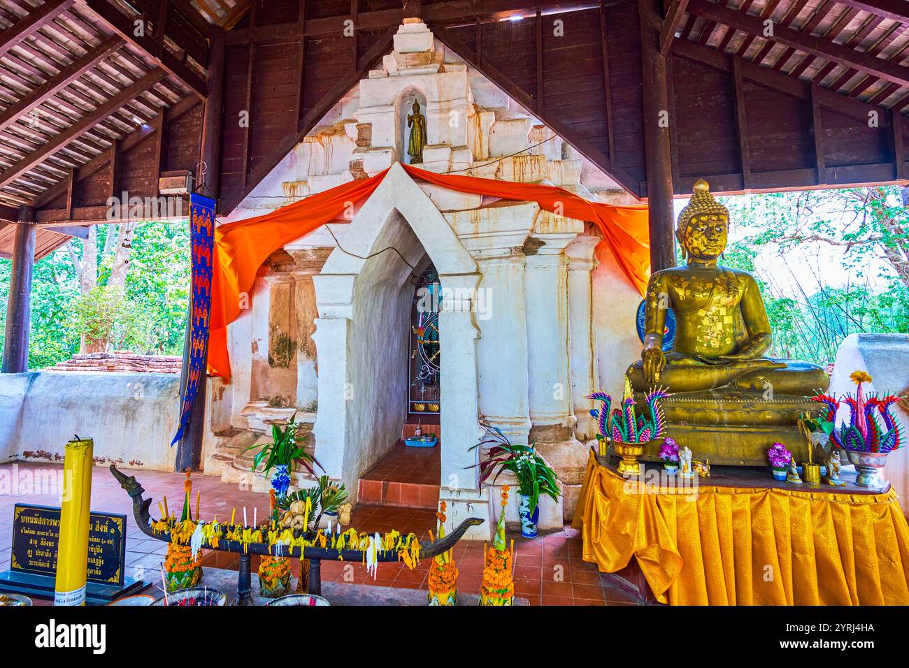 The image house of Phrathat Pukhaw temple complex with Altar and golden ...