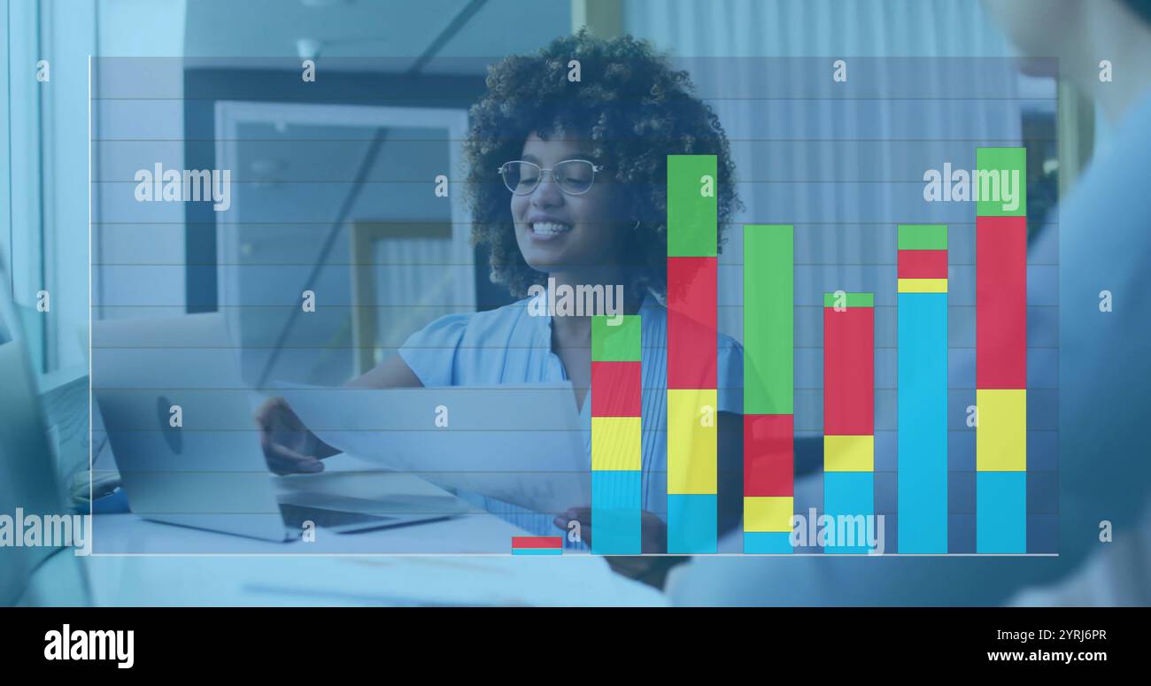 Businesswoman reviewing documents, bar chart image over office ...