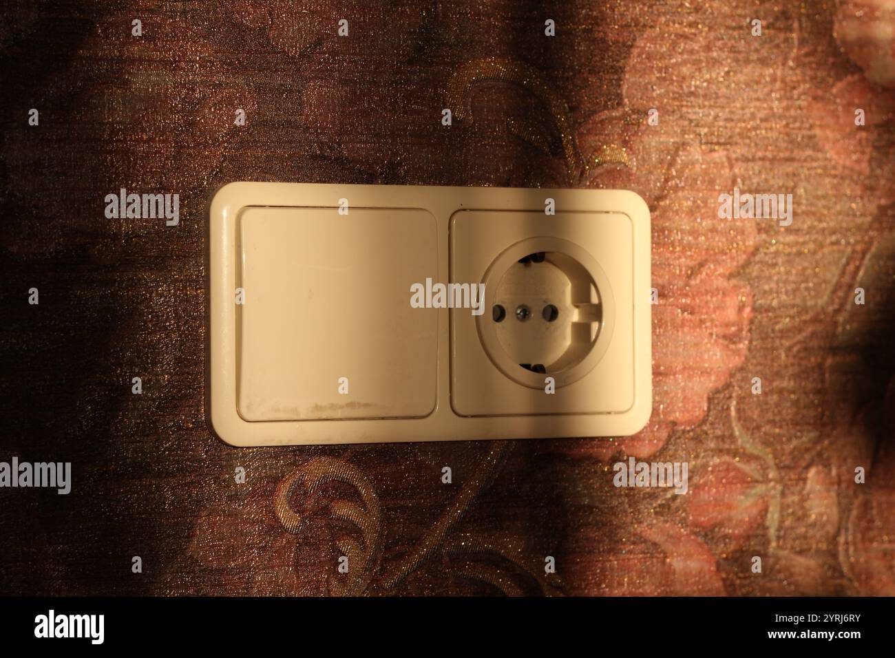 A modern electrical outlet is beautifully positioned on a decorative ...
