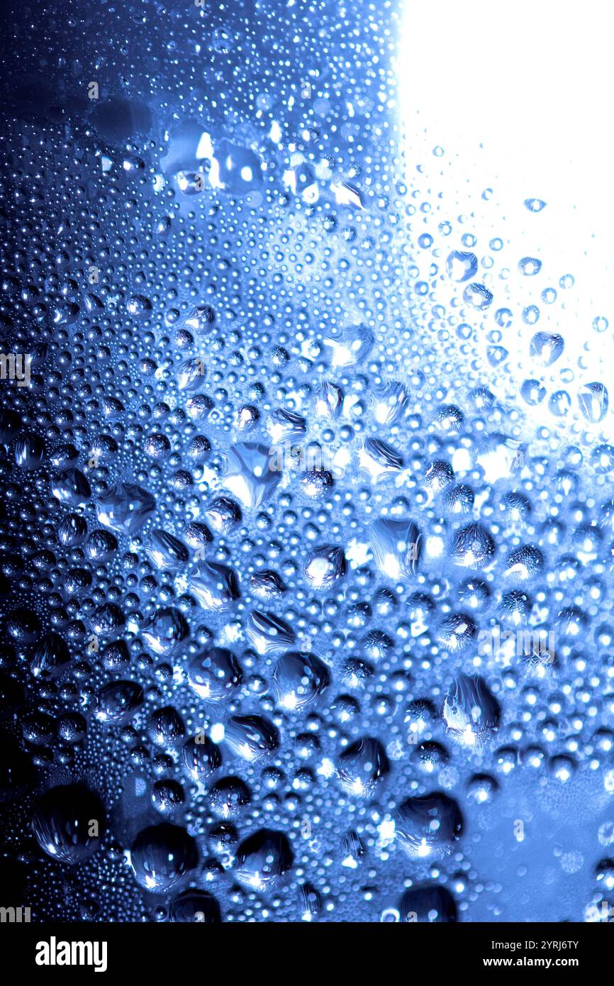 Blue Rain Bubbles Drops Running down a Window on a Wet Day Abstract ...