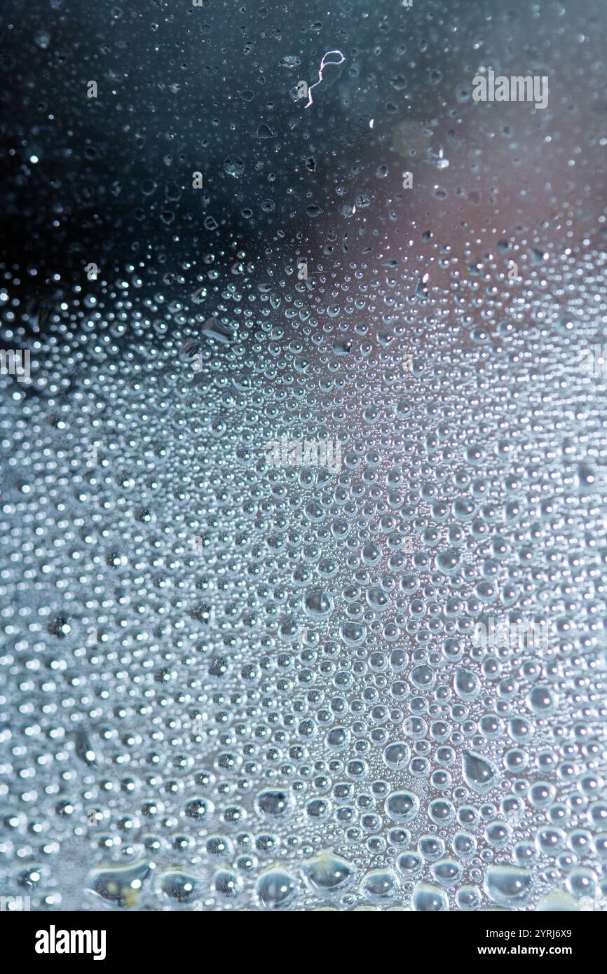 Blue Rain Bubbles Drops Running down a Window on a Wet Day Abstract ...