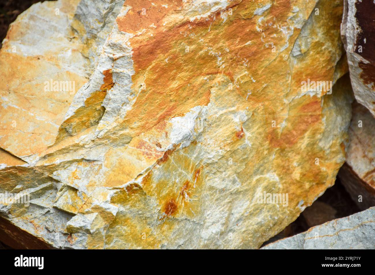 Amorphous rocks, yellow, white, brown color Stock Photo - Alamy