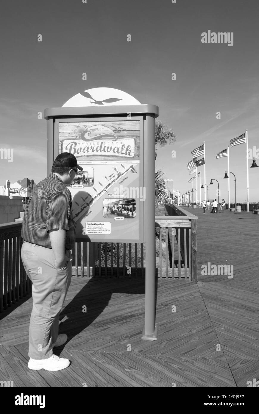 Male caucasian tourist reading sign hi-res stock photography and images ...