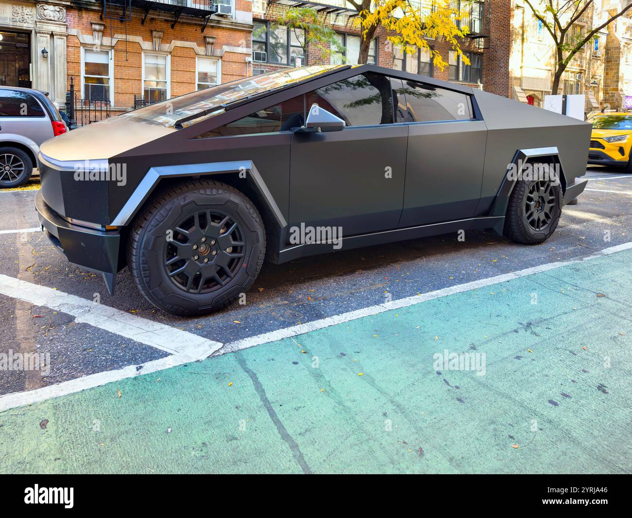 Tesla Cybertruck Futuristic matte black electric vehicle with angular ...