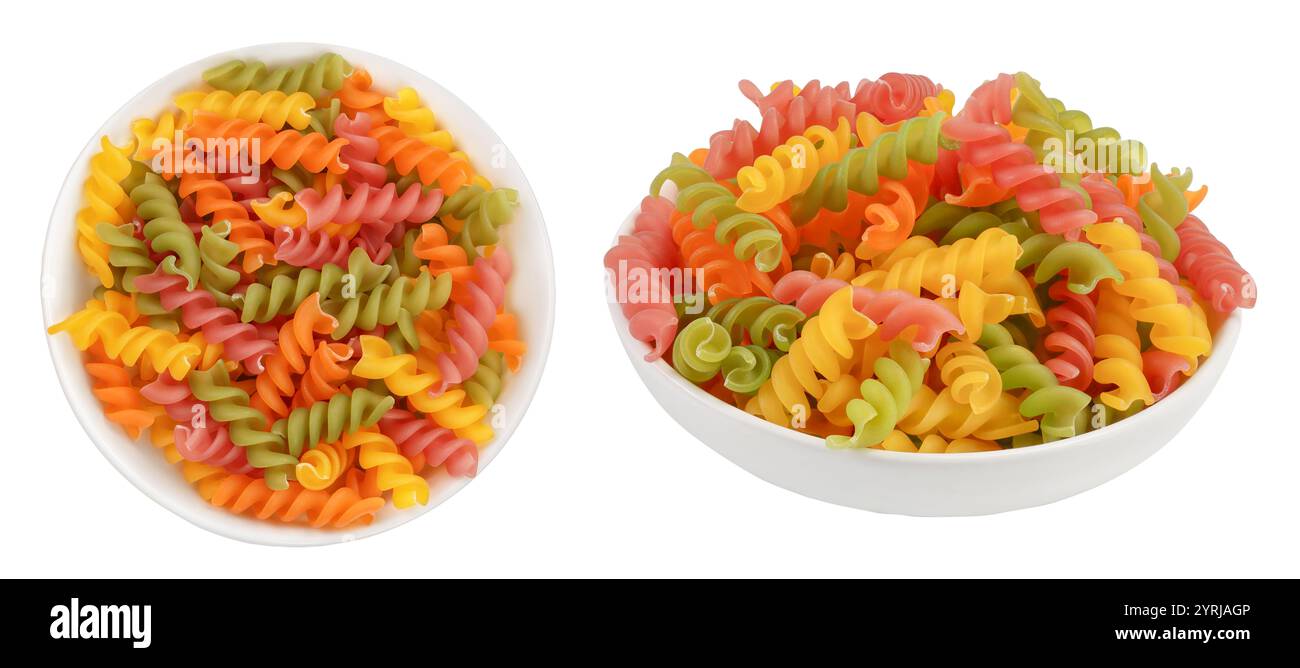 raw Fusilli colored pasta in ceramic bowl isolated on white background ...
