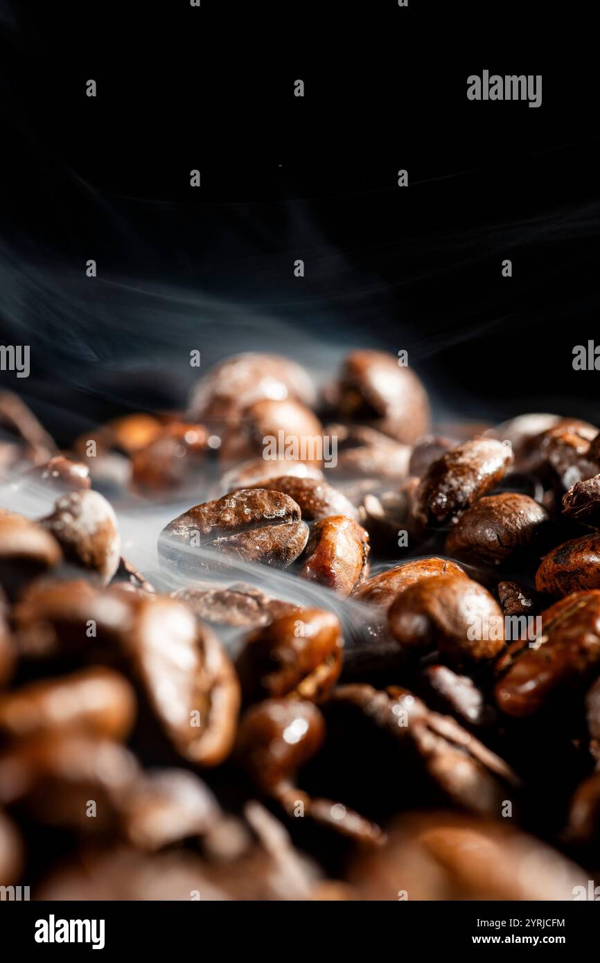 Image taken with a macro lens of a multitude of steaming coffee beans ...