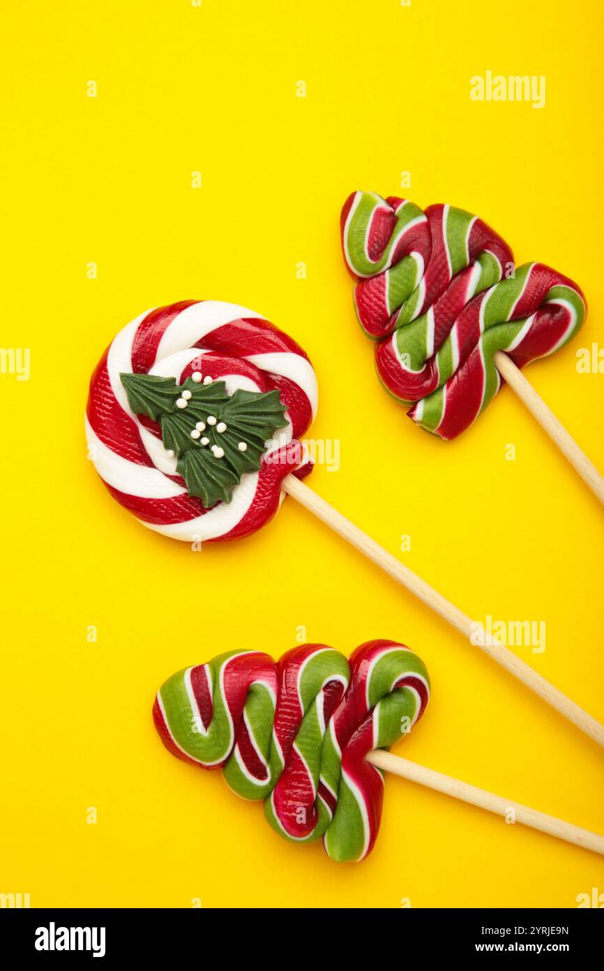 Christmas Candy on yellow background. Sweet lollipop. Top view Stock ...