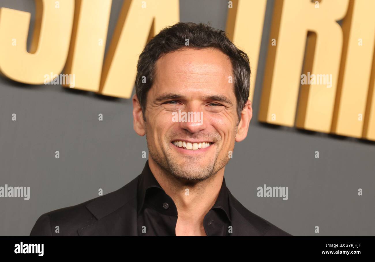 Hollywood, Ca. 03rd Dec, 2024. Scott Daniel Johnson at the premiere of Netflix's The Six Triple ...