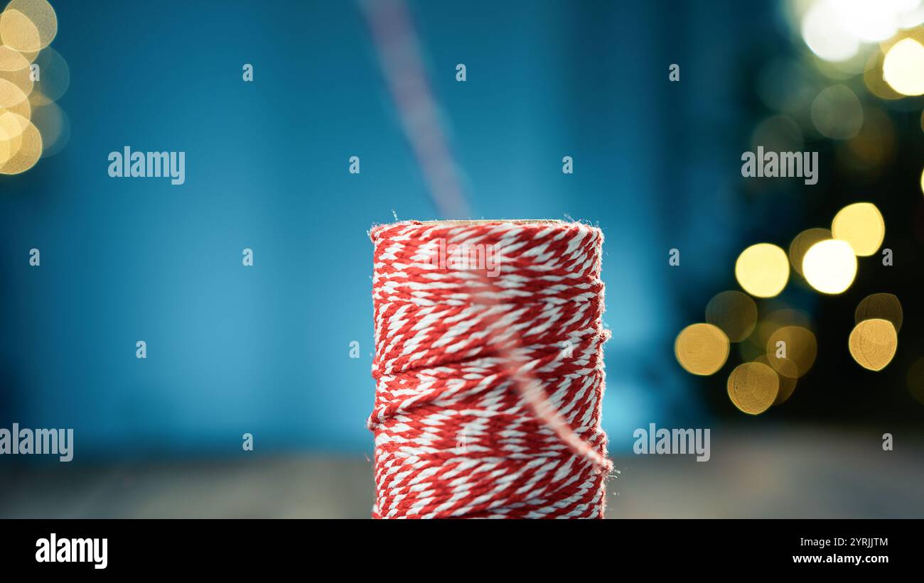 Christmas thread spool rotates continuously Stock Photo - Alamy