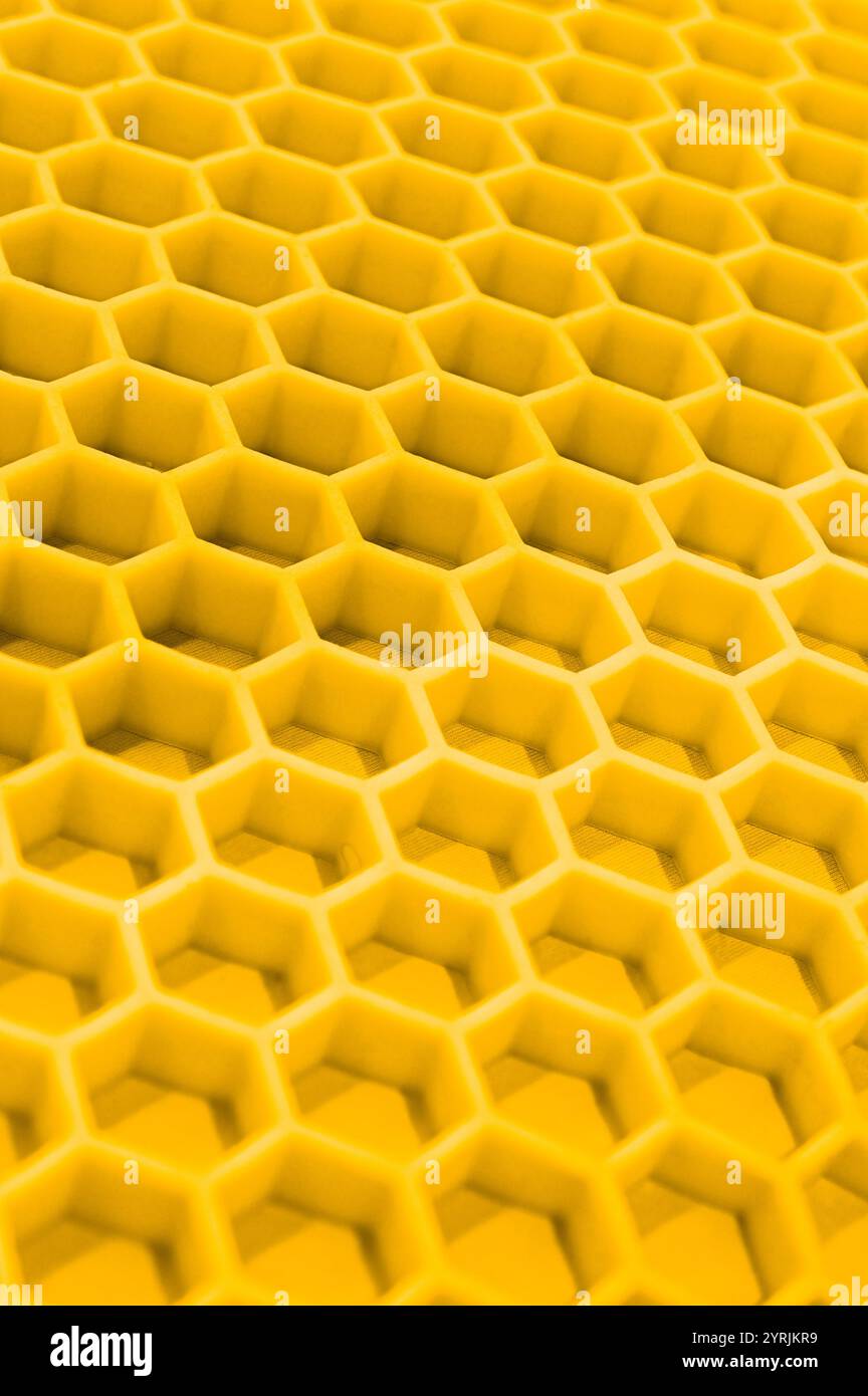 A lot of yellow hexagonal cells, similar to a honeycomb, abstract background Stock Photo - Alamy