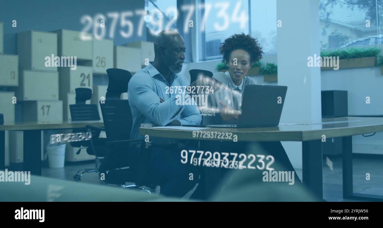 Business professionals discussing over laptop with floating numbers ...
