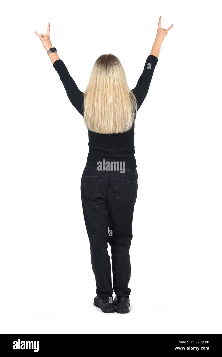 back view of a woman showing the horns sign with fingers on white ...