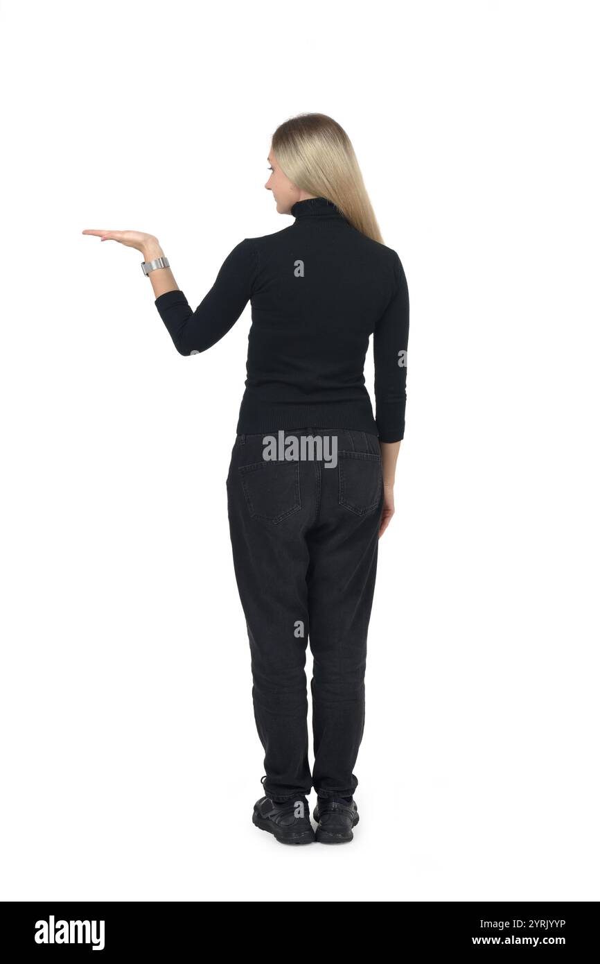 back view of a woman showing an imaginary object in her hand and ...