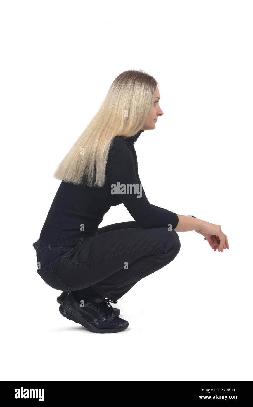side view of a woaman sitting on her haunches on white background Stock ...