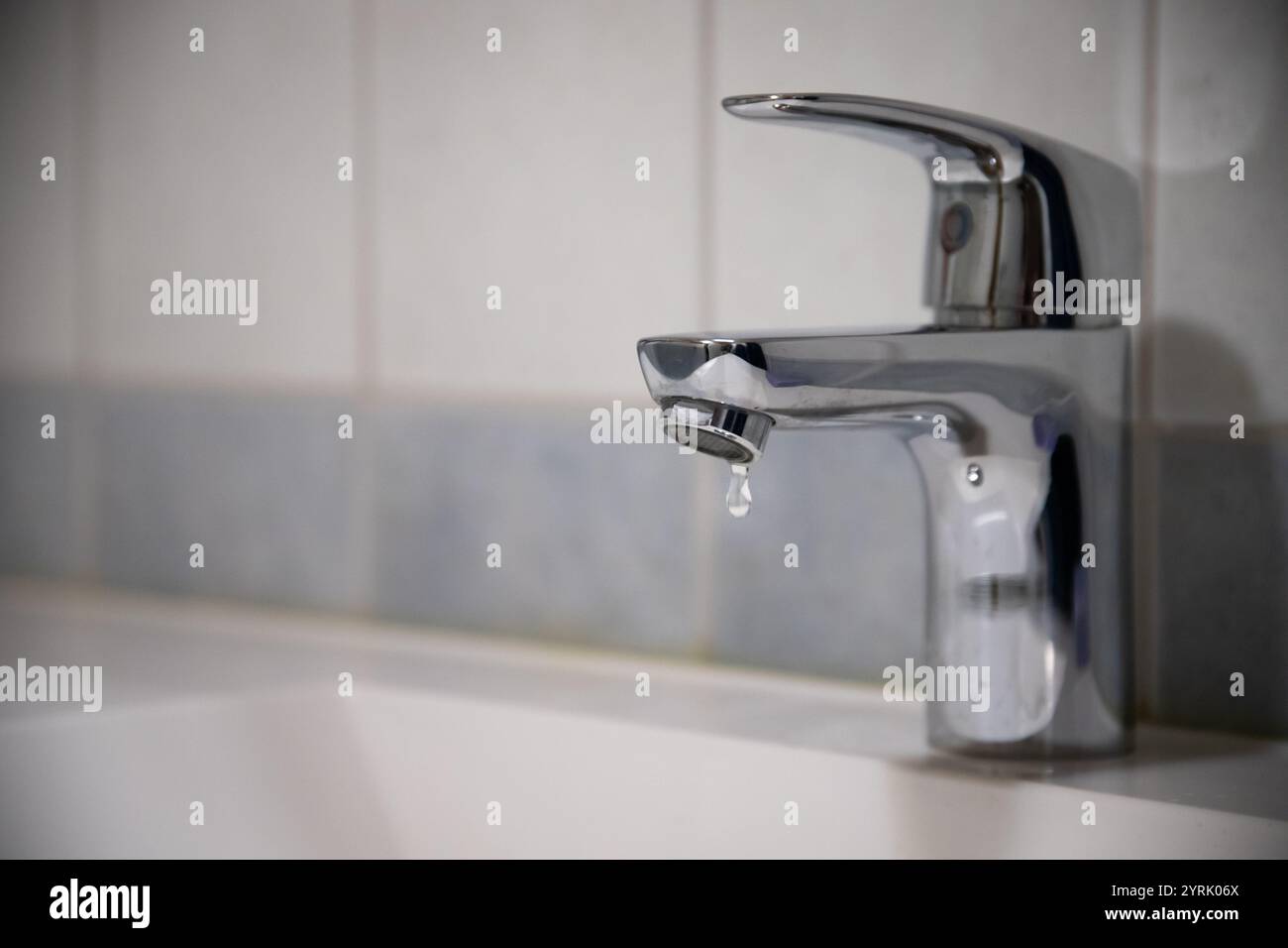 a Close-up of a leaking faucet dripping water Stock Photo - Alamy