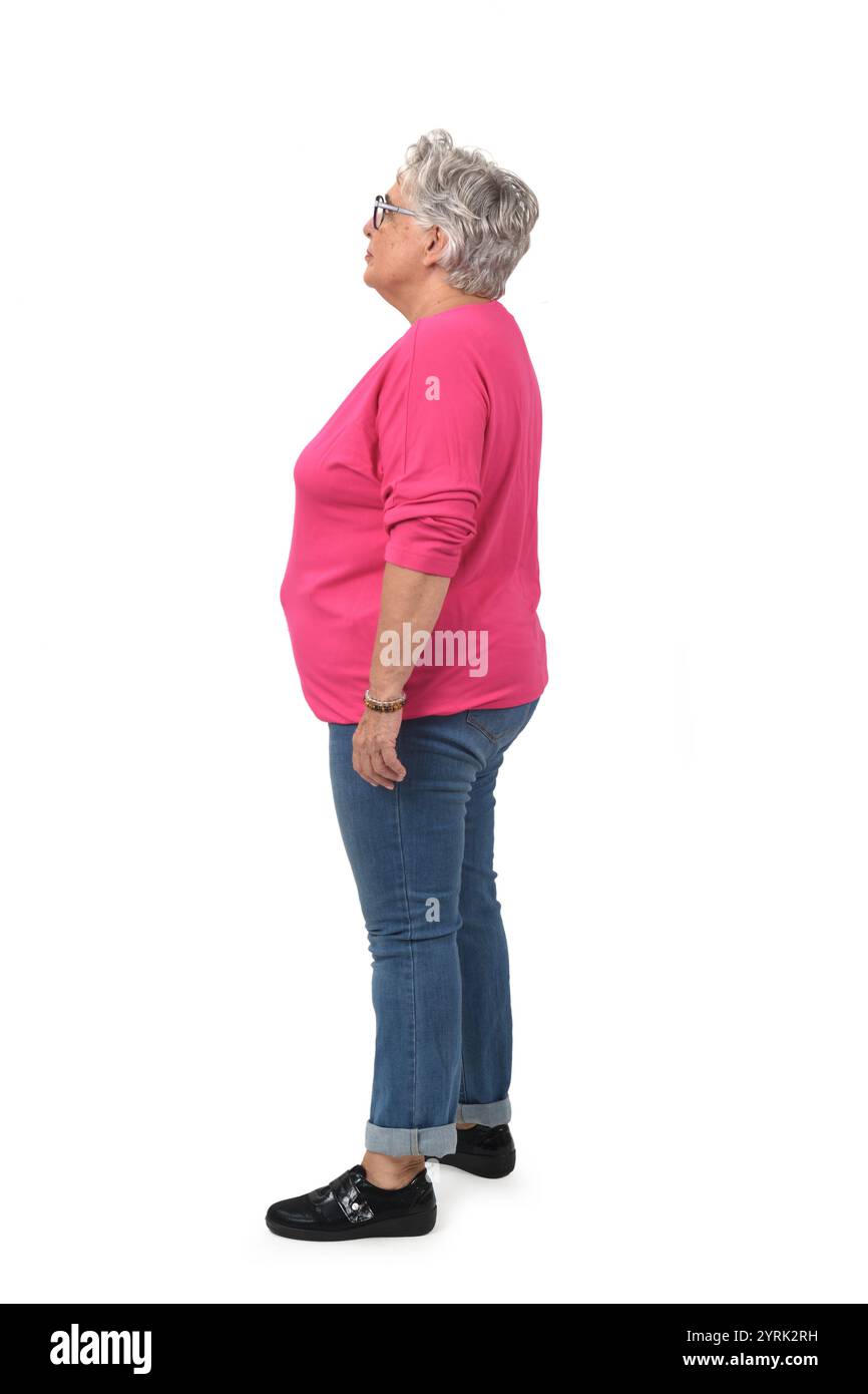 side view portrait of standing senior woman on white background Stock ...