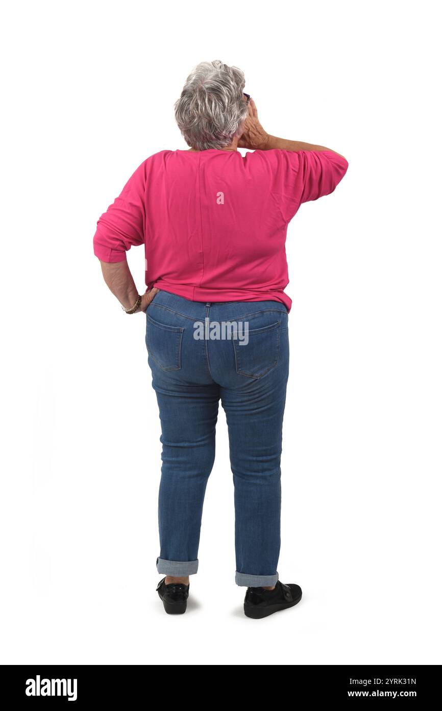 back view of a screaming senior woman and raised arms on white ...