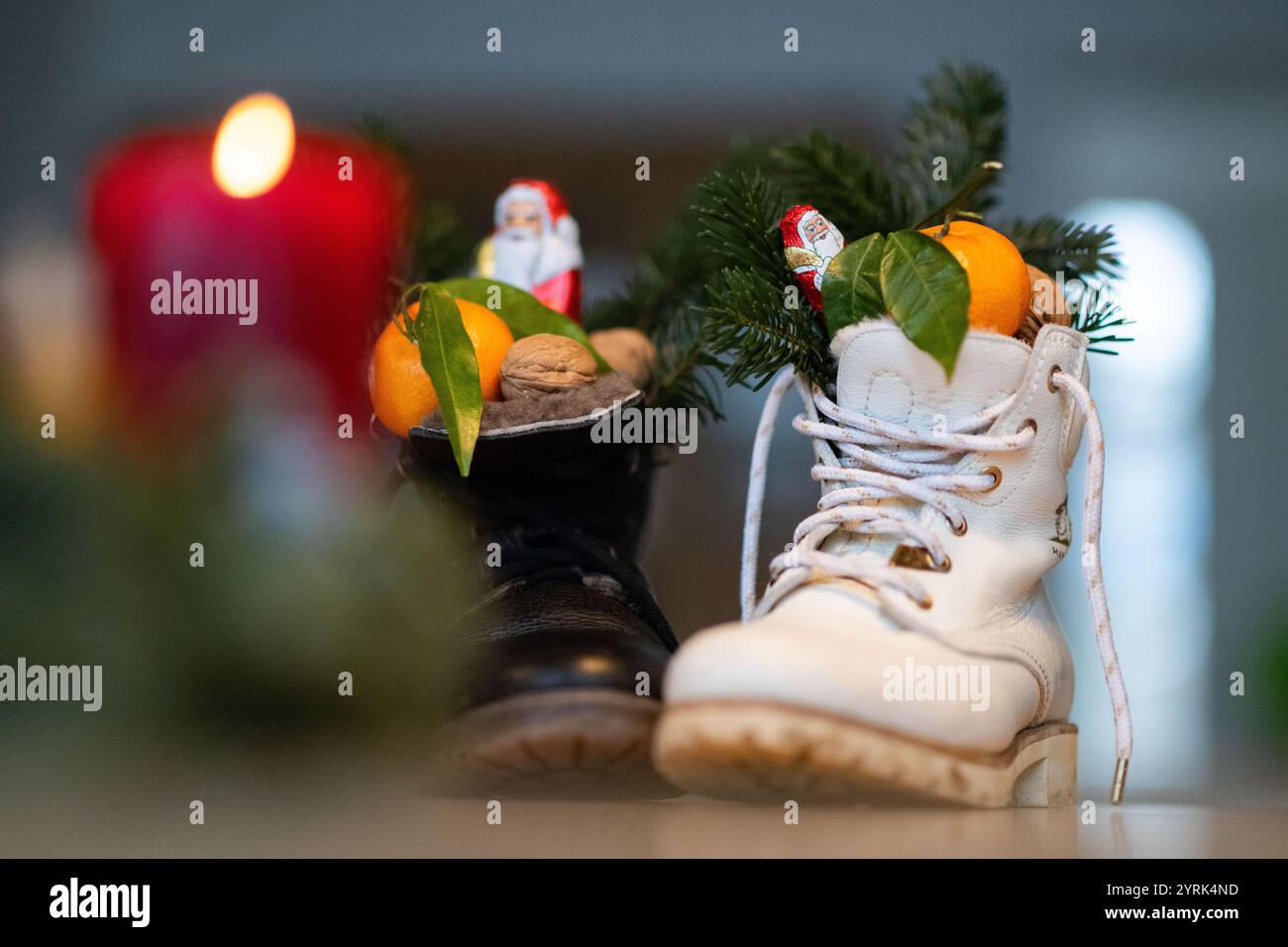 Stuttgart, Germany. 04th Dec, 2024. Boots filled with citrus fruits ...
