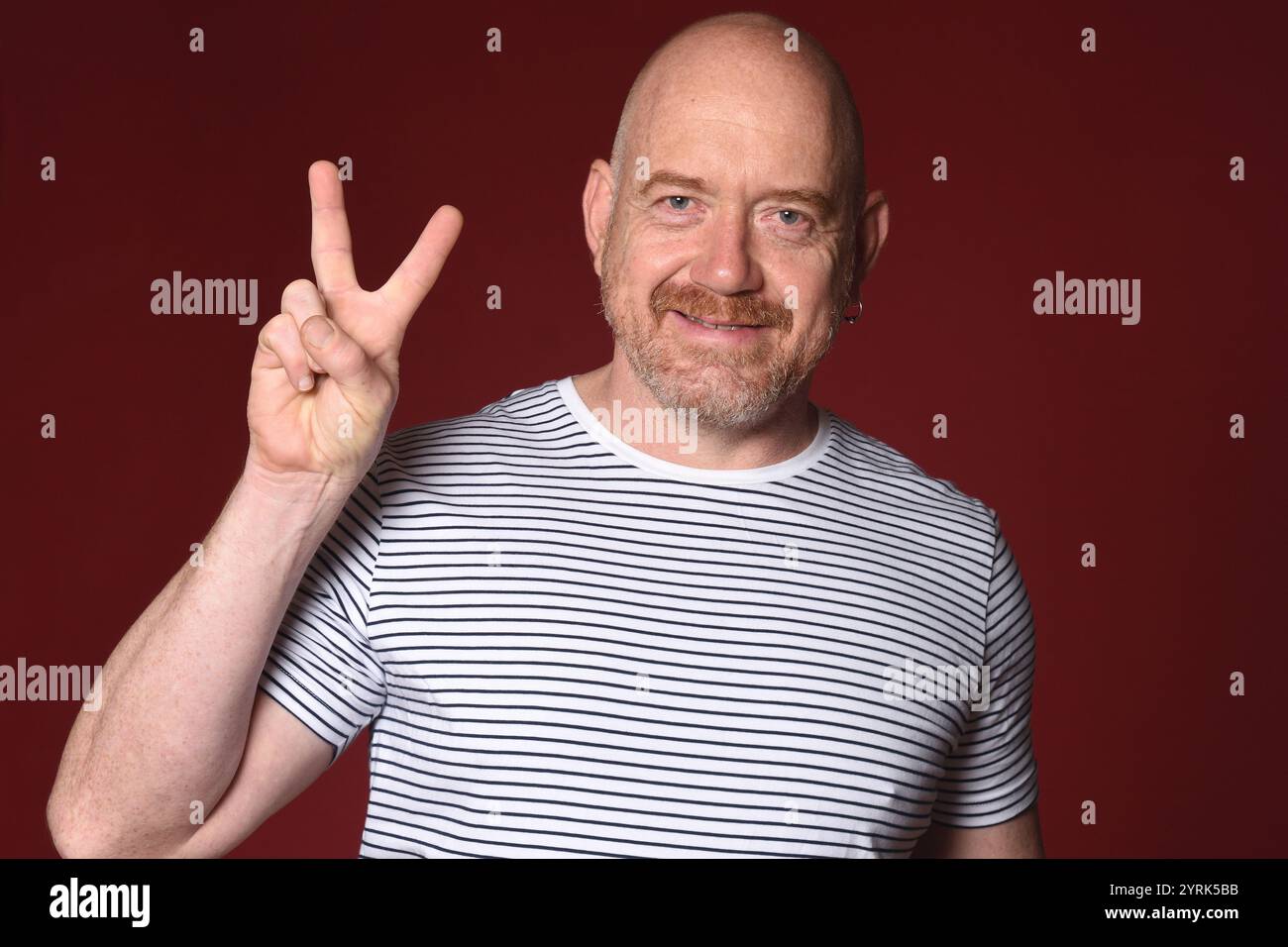 Victory sign middle aged man hi-res stock photography and images - Alamy