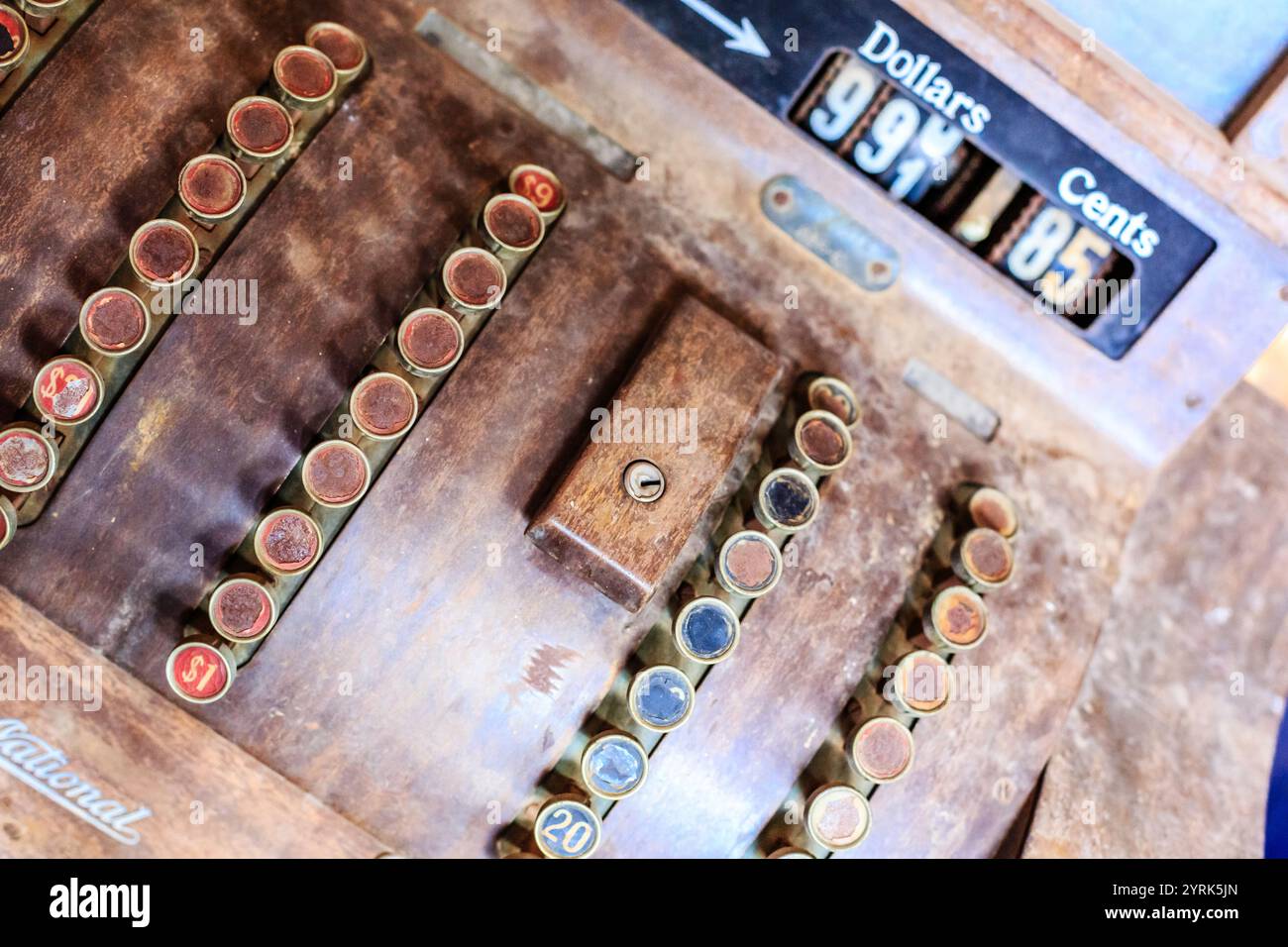 A National Cash Register with a wooden counter and a black and white ...