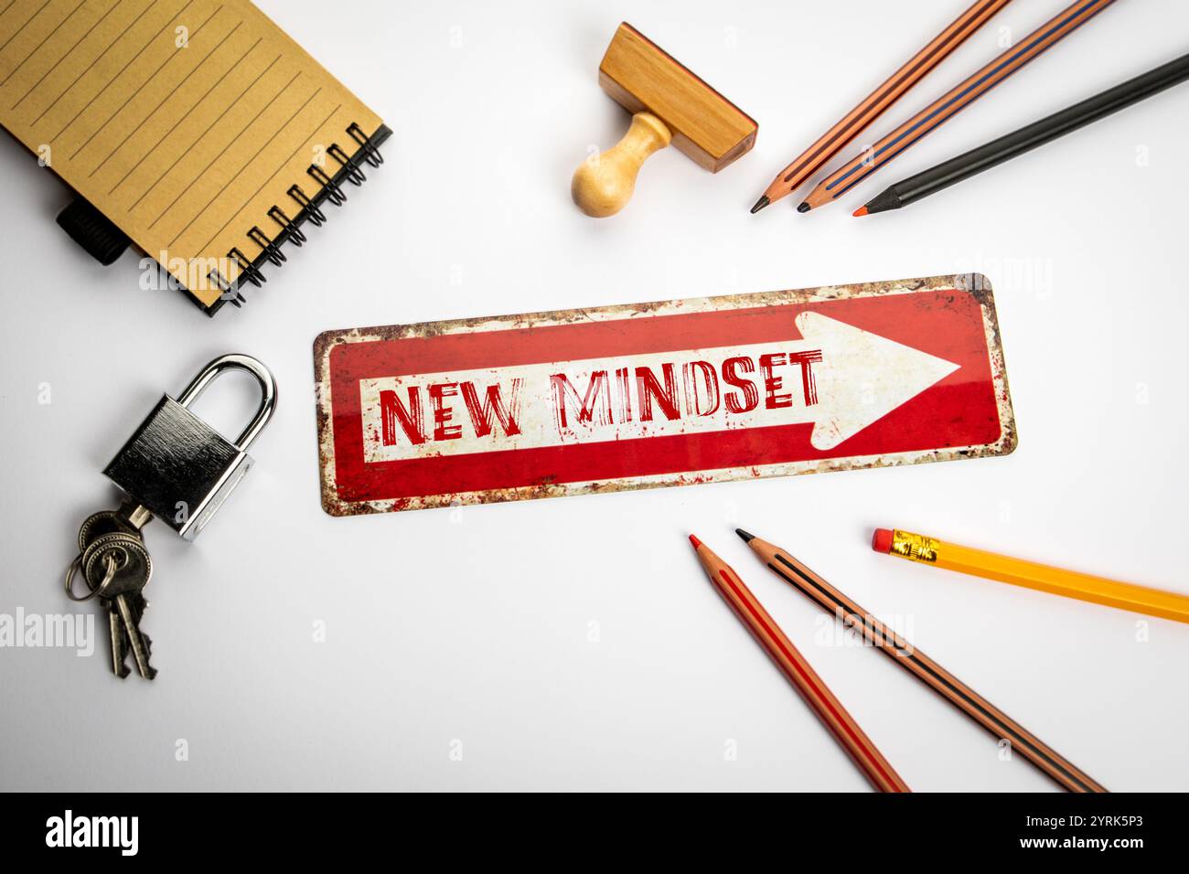 New Mindset. Red direction arrow with text on office desk Stock Photo ...