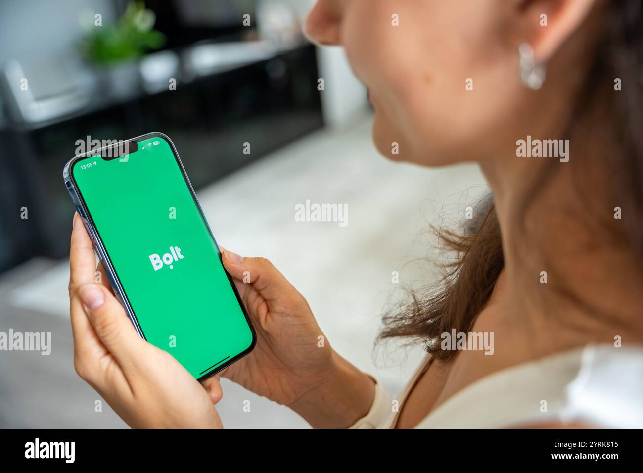 Prague, Czech republic - May 2, 2024: Woman holding iPhone with logo of ...