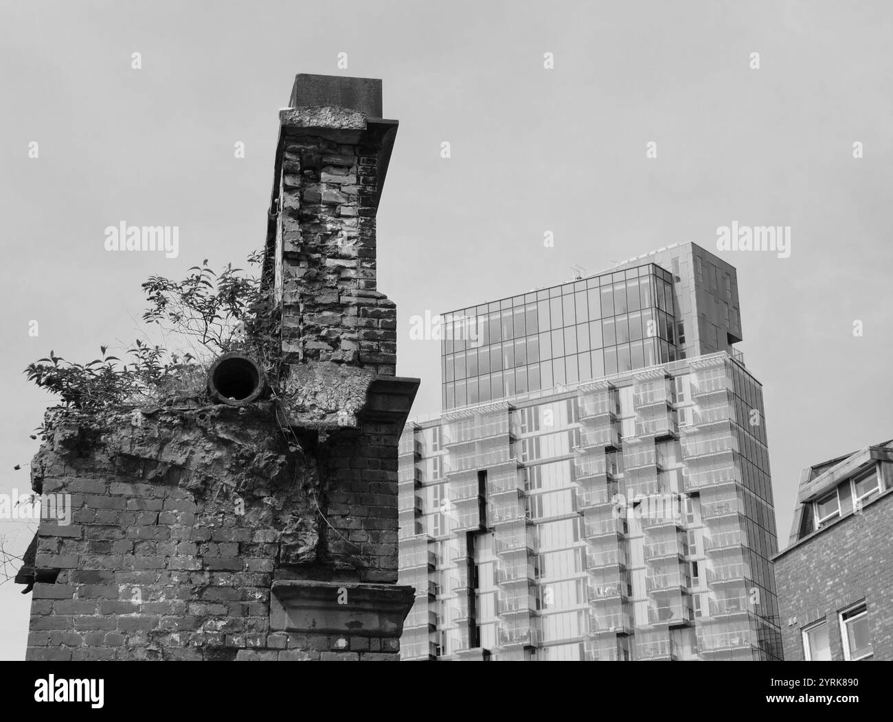 Ruined brick wall and modern building at backgrounds. London, UK. Time ...