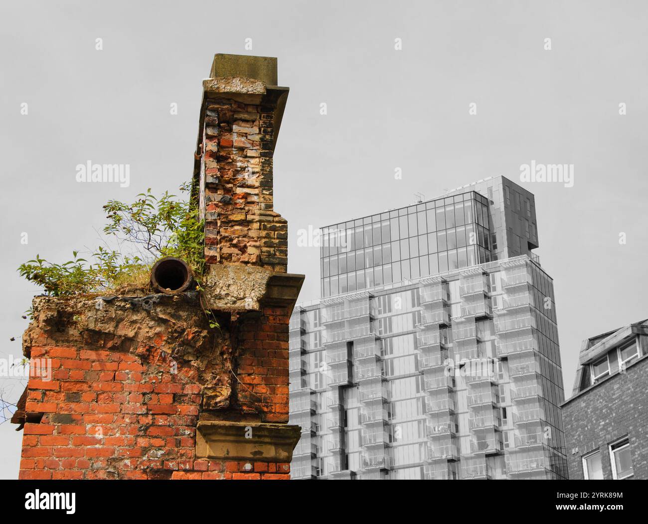 Ruined brick wall and modern building at backgrounds. London, UK. Time ...