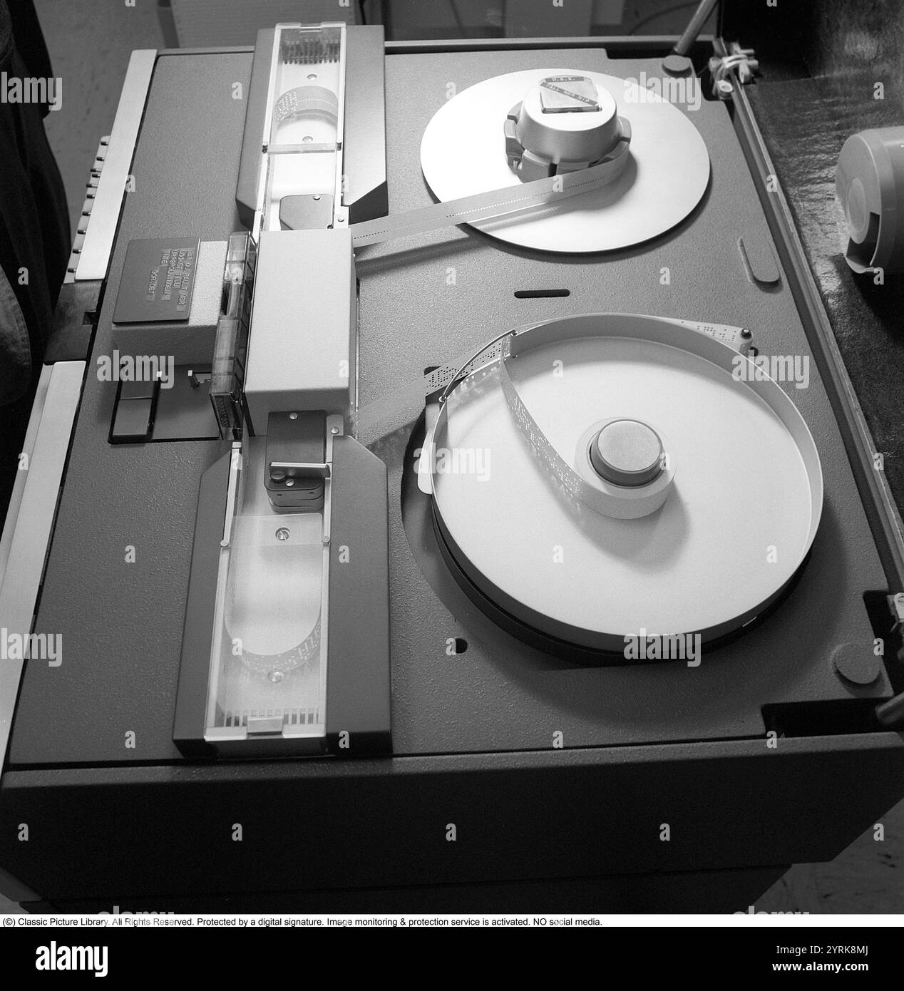 In the 1960s. A unit within a IBM system 360 and a punched tape reader ...