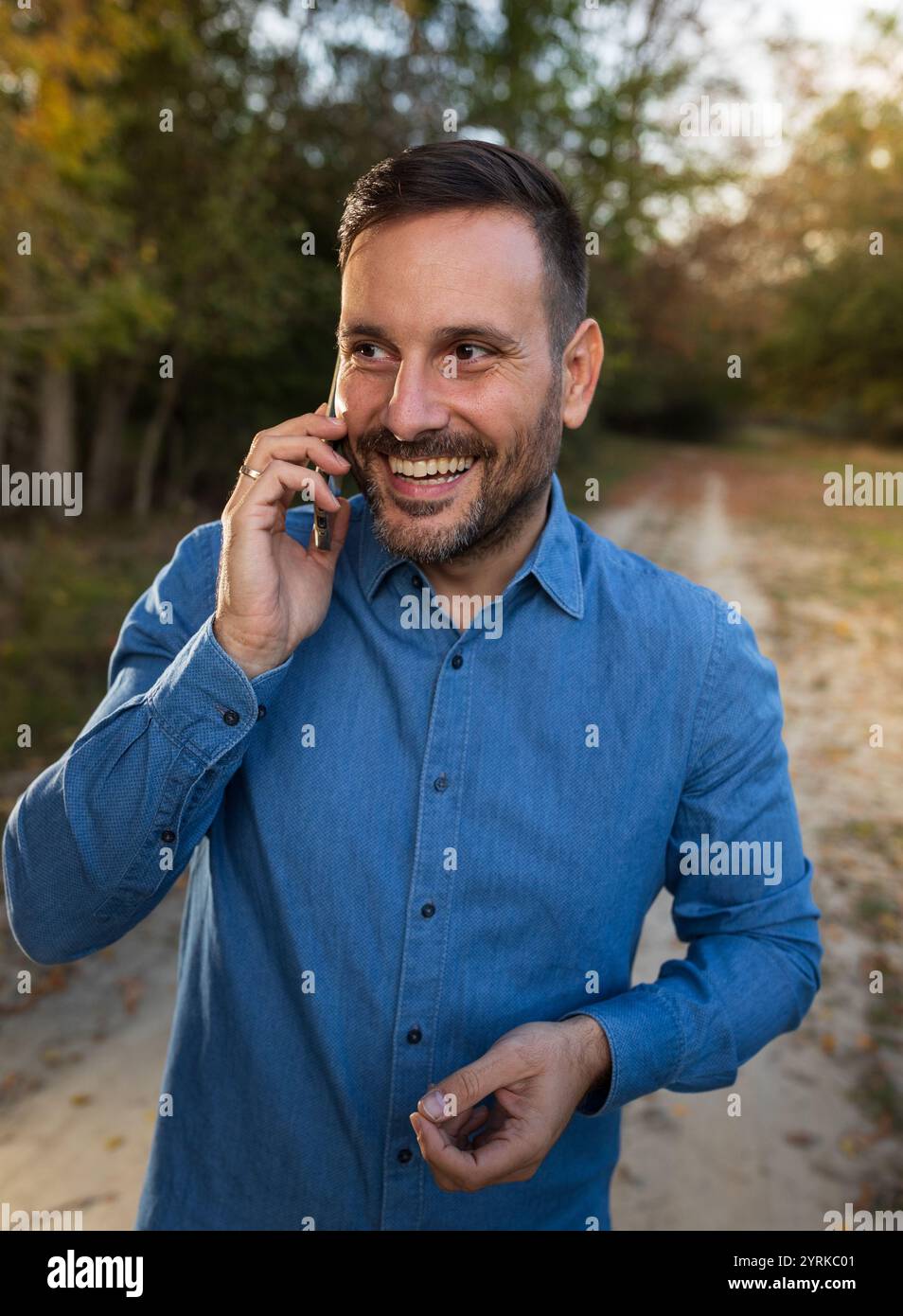 Confident businessman smartphone walking country hi-res stock ...