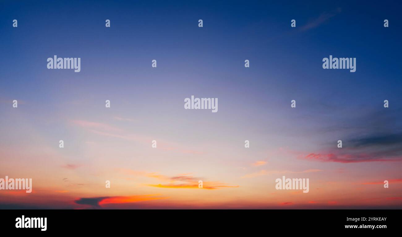 blue sky with delicate clouds on a pink sunset background in summer ...