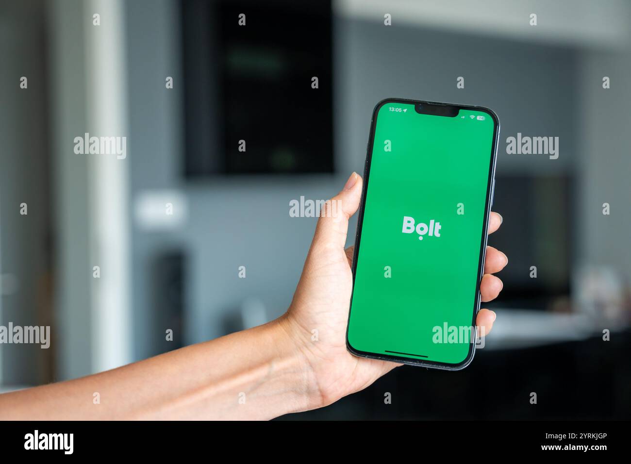 Prague, Czech republic - May 2, 2024: Woman holding iPhone with logo of ...