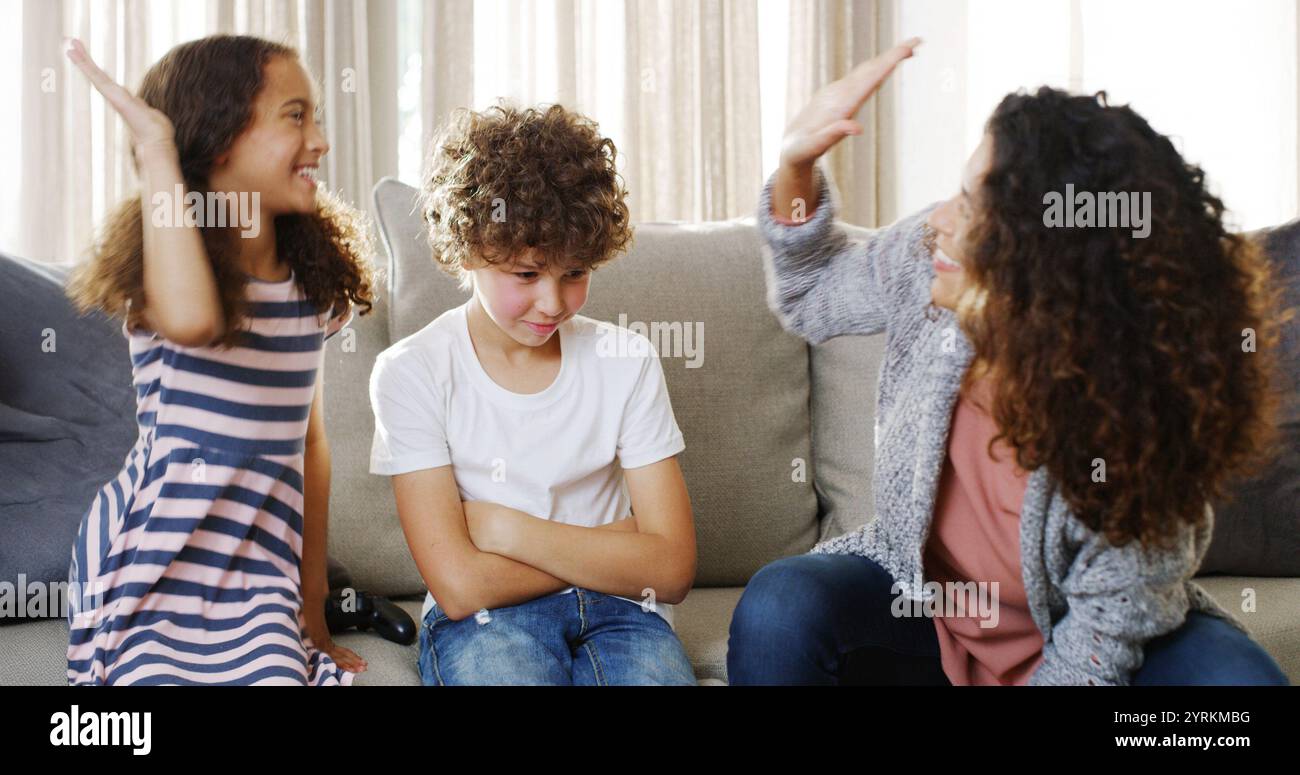 Mom, girl and high five for video games in home, loser son and ...
