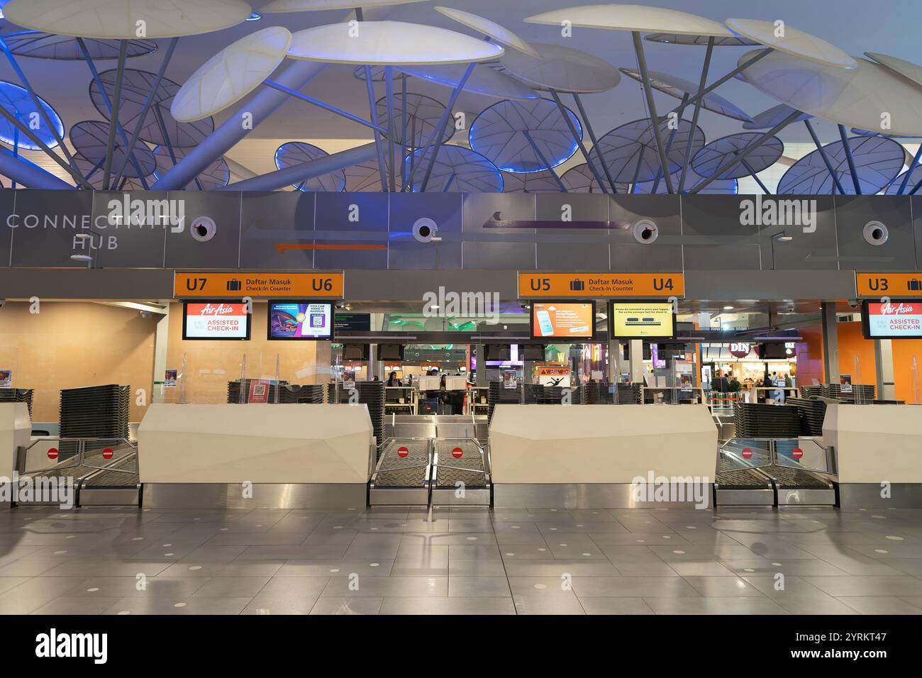 KUALA LUMPUR, MALAYSIA - NOVEMBER 14, 2023: check-in counters at KLIA2 ...